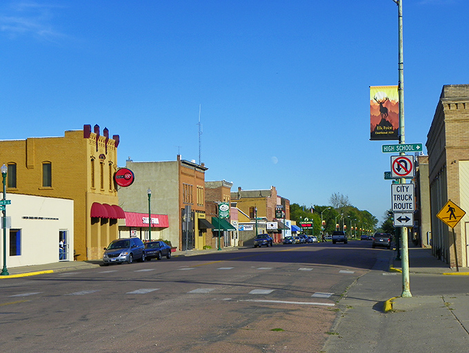 Main Street magic! Elk Point's downtown stretches before you like a living postcard, where historic buildings stand proudly against South Dakota's impossibly blue sky.