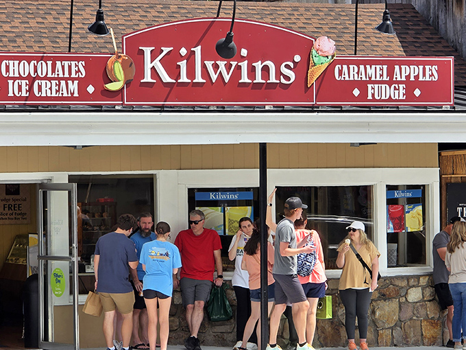 Kilwins&rsquo; red storefront lures you in&mdash;mountain air, sweet treats, and pure Tennessee charm.