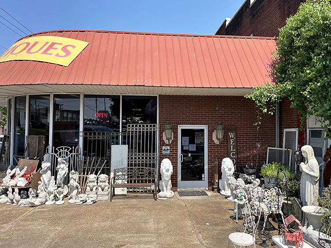 The distinctive red roof and guardian stone lions welcome treasure hunters to Goodlettsville Antique Mall, where history spills onto the sidewalk.