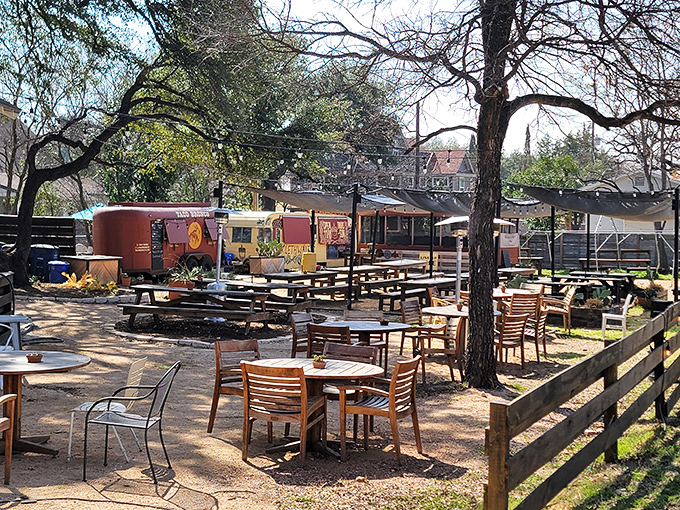 The outdoor dining area at Micklethwait is pure Austin magic &ndash; picnic tables under shade trees where barbecue dreams come true and time slows to a perfect, meat-induced standstill.