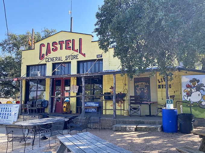 The sunshine-yellow exterior of Castell General Store stands as a beacon of hope for hungry travelers in the Texas Hill Country.