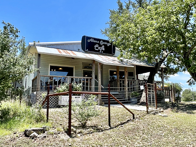 The unassuming exterior of Alamo Springs Cafe stands like a culinary mirage in the Hill Country, promising burger nirvana to those who make the journey.