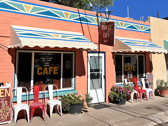 The iconic red sign of Main Street Cafe stands out against the colorful exterior, like a beacon calling hungry travelers home to Hurricane.