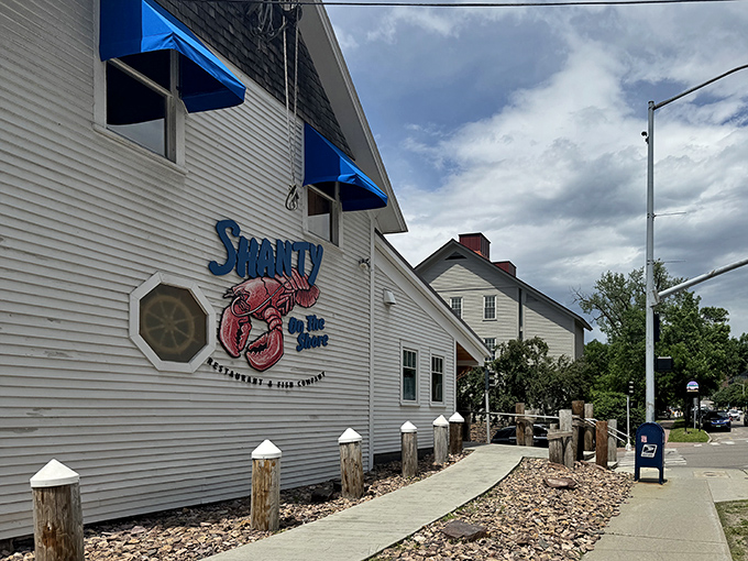 The classic white clapboard exterior with that iconic lobster sign is like a maritime beacon calling hungry sailors home to Burlington's waterfront.