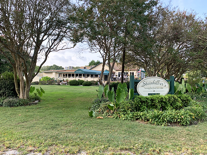 Tucked away like a secret, Steinhilber's welcomes you with manicured grounds and a sign that promises culinary magic awaits inside.