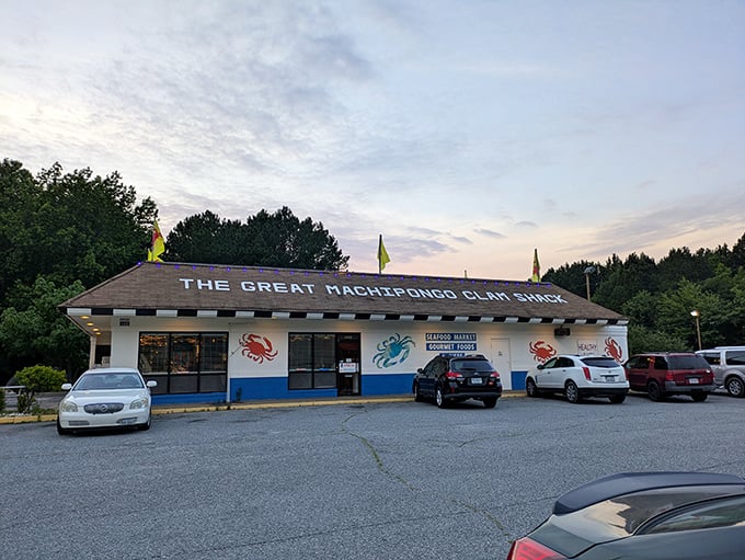The blue and white exterior with colorful crustacean paintings announces you've arrived at seafood paradise. Yellow flags flutter overhead like maritime welcome banners.