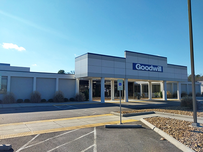 The modern facade of Richmond's Goodwill Outlet stands like a temple to thrift, beckoning bargain hunters with its clean lines and promise of treasures within.