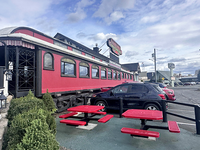 The red railcar stands proudly against Spokane's sky, complete with outdoor seating for those "I need fresh air but also pancakes" moments.