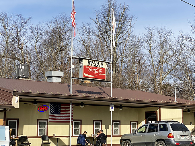 The classic American flag and Coca-Cola sign combo – Mom's Place doesn't need fancy architecture when the breakfast inside speaks volumes.