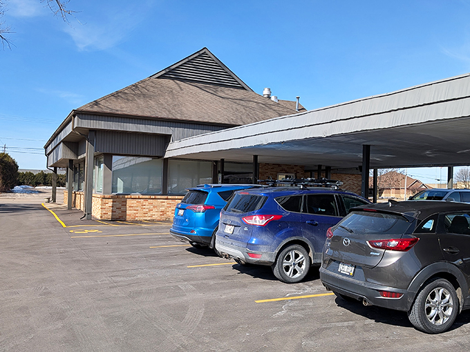 The distinctive triangular roof of Mike's Place stands like a beacon for breakfast lovers across Wisconsin. No wonder the parking lot is rarely empty.