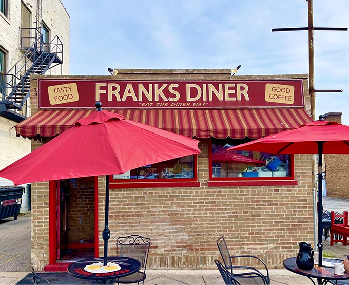 That iconic red awning isn't just calling your name&mdash;it's practically shouting "breakfast nirvana awaits!" Frank's Diner stands proud against the Wisconsin sky, a beacon of comfort food.