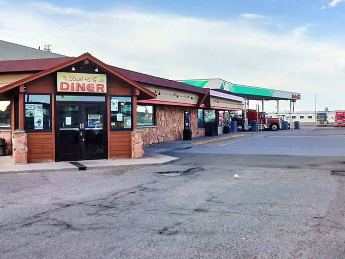 The rustic stone-and-timber exterior of Down Home Diner stands as a beacon of breakfast hope beneath the vast Wyoming sky. Inside, morning salvation is served hot.