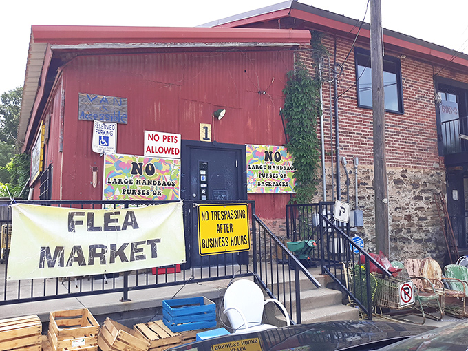 The unassuming red exterior might fool you, but that "FLEA MARKET" banner is actually a portal to treasure-hunting nirvana.