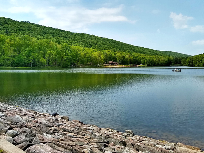 Poe Valley Lake’s calm, glassy water mirrors the surrounding hills and trees—a peaceful retreat where nature does all the talking.