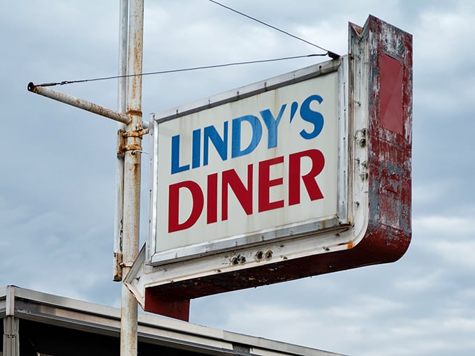This weathered sign has guided hungry travelers to Lindy's for generations, its vintage charm perfectly setting expectations for the classic diner experience within.