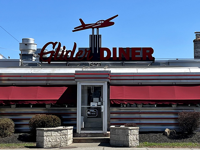 The iconic Glider Diner sign welcomes hungry travelers with its vintage airplane perched proudly above. Classic Americana at its finest!