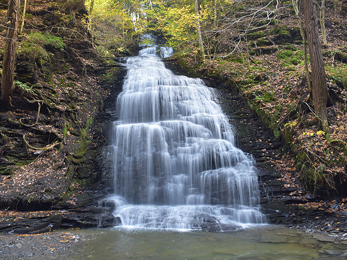 Cascading like nature's own staircase, this waterfall transforms in autumn when surrounded by a kaleidoscope of fall foliage &ndash; Mother Nature showing off her best work.