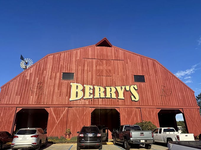 The iconic red barn exterior of Berry's stands proudly against the Mississippi sky, like a beacon calling hungry travelers home to seafood paradise.