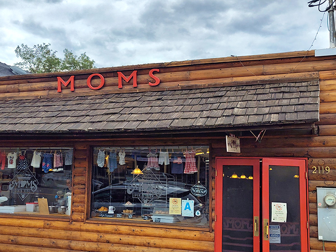 The rustic wooden exterior of Mom's Pie House beckons like an old friend, those red doors promising sweet salvation after your mountain drive.