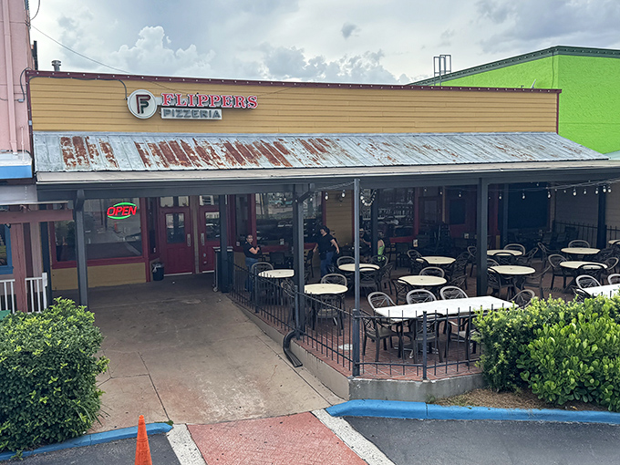 The unassuming yellow storefront of Flippers Pizza stands like a beacon of hope for the pizza-deprived in Old Town Kissimmee.