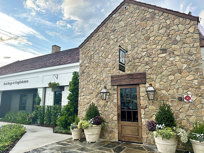The stone facade of Mad Dogs and Englishmen stands like a British country cottage that somehow floated across the Atlantic and landed perfectly in Tampa.