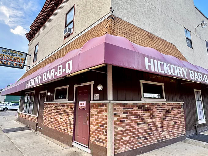 The iconic purple awning of Hickory Bar-B-Q stands as a beacon of barbecue bliss in Dayton, promising smoky treasures within its unassuming brick walls.