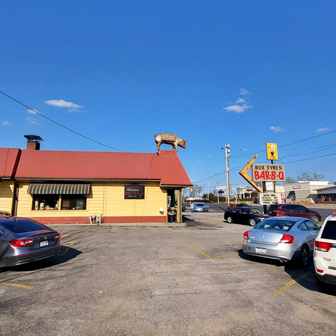 Blue skies, red roof, yellow walls, and that legendary pig silhouette&mdash;the universal language of "get ready for barbecue that'll make your taste buds dance."
