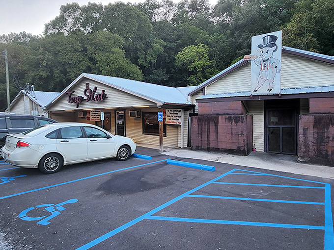 The unassuming exterior of Top Hat BBQ stands like a culinary lighthouse in Hayden, beckoning hungry travelers with its simple charm and promise of smoky delights.