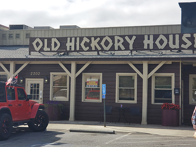The unassuming exterior of Old Hickory House stands like a time capsule in Tucker, promising authentic Southern flavors behind that weathered wooden facade.