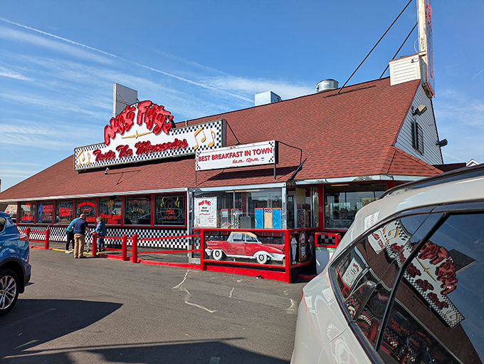 The neon-lit promise of "Taste The Memories" isn't just clever marketing—it's a time-traveling invitation backed by those iconic American flags waving you inside.