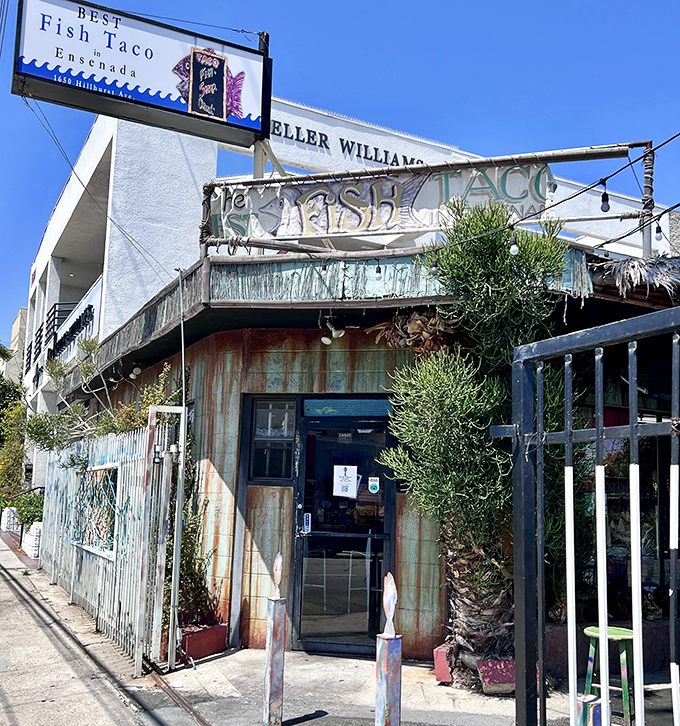 The weathered turquoise exterior of Best Fish Taco in Ensenada stands proudly on a Los Feliz corner, promising authentic Baja flavors in urban LA.