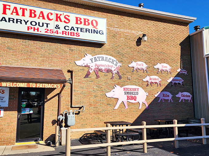 The pig silhouettes on Fatback's brick exterior aren't just decoration—they're a roadmap to carnivorous bliss. BBQ paradise, straight ahead!