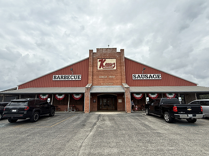 The barbecue temple of Lockhart stands proud, its brick facade and bold signage promising meat-based salvation to all who enter.