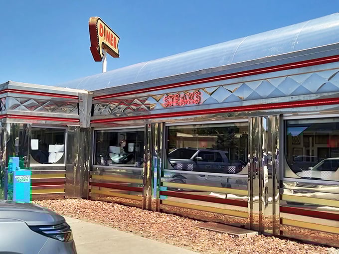 The gleaming stainless steel exterior of Dad's Diner stands like a time capsule in Farmington, beckoning hungry travelers with its classic neon signage and promise of comfort food.
