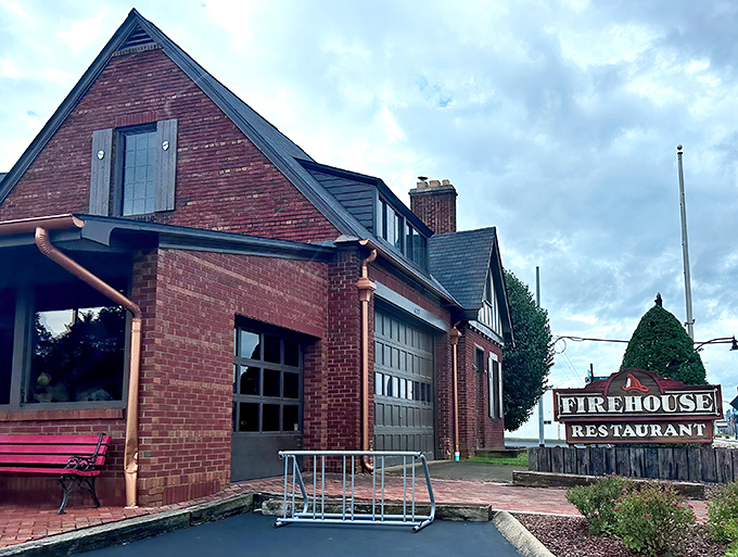 The historic brick exterior of The Firehouse stands as a mouthwatering beacon of barbecue promise, complete with original firehouse architecture and modern culinary purpose.
