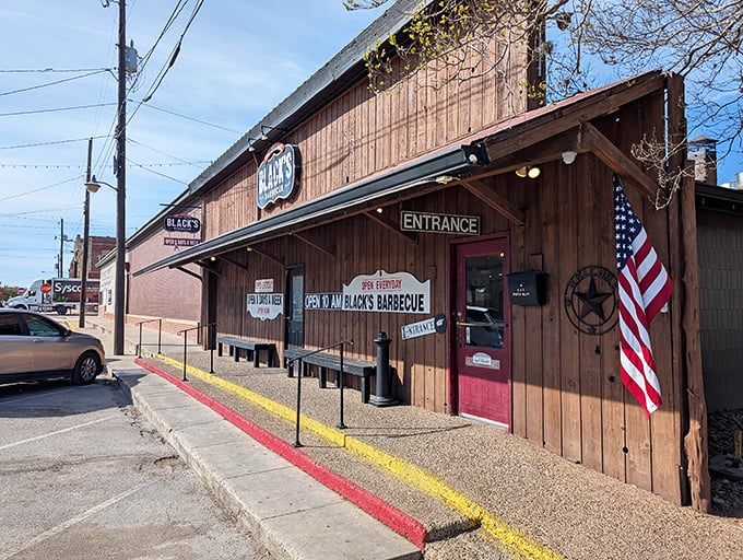 That weathered wood exterior isn't trying to impress anyone, which is exactly why it impresses everyone who knows good barbecue.