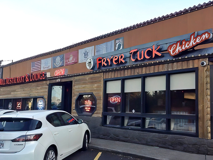 A wider view reveals the unassuming charm of this Portland institution, where neon "OPEN" signs beckon hungry travelers like lighthouse beacons.