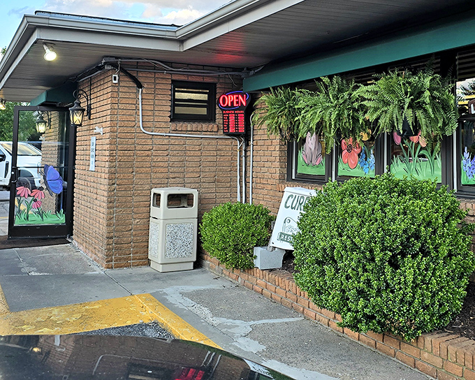 The entrance to Clyde's offers a glimpse into small-town dining perfection &ndash; where "curbside pickup" means they actually care enough to come outside.