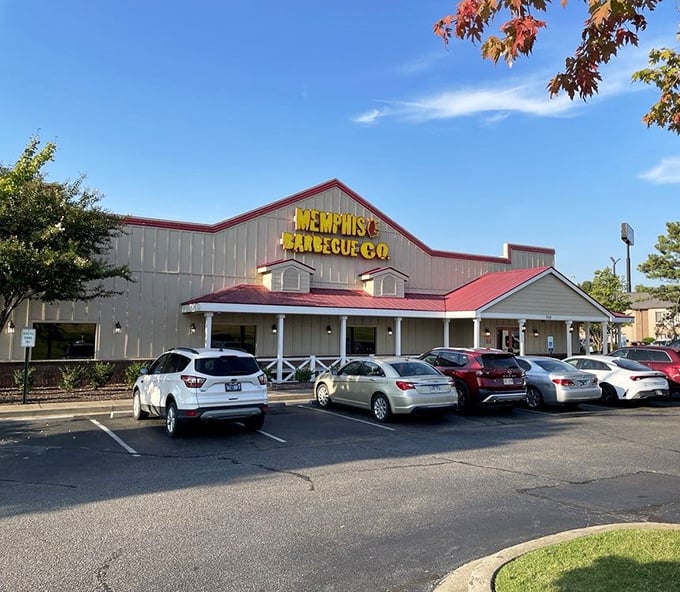 Yellow sign glowing against blue skies, Memphis BBQ Company stands like a beacon of hope for the hungry traveler. Salvation through smoke awaits.
