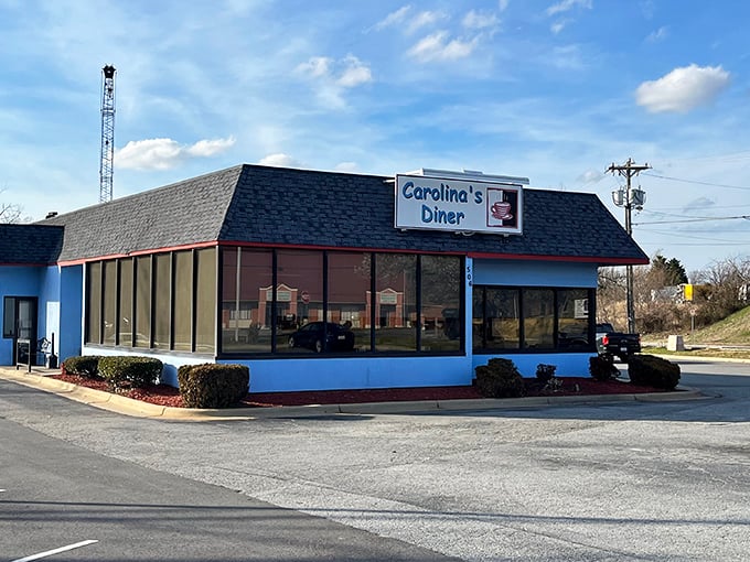 The blue-trimmed exterior of Carolina's Diner stands like a time capsule of Americana, promising comfort food treasures within its unassuming walls.