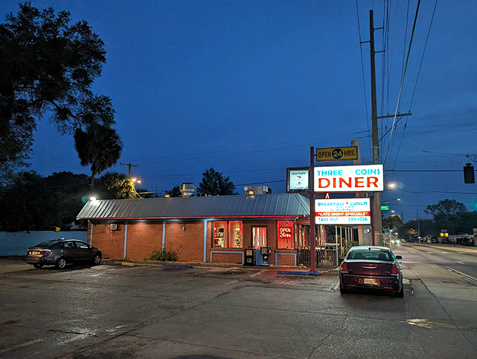The neon glow of Three Coins Diner cuts through Tampa's twilight like a beacon for the breakfast-deprived. Open 24 hours because hunger doesn't punch a timecard.