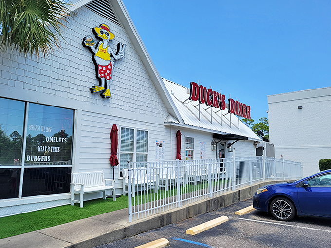 Duck's bright white exterior with its cheerful mascot practically screams "vacation mode activated!" Even the white picket fence looks like it's smiling at you.