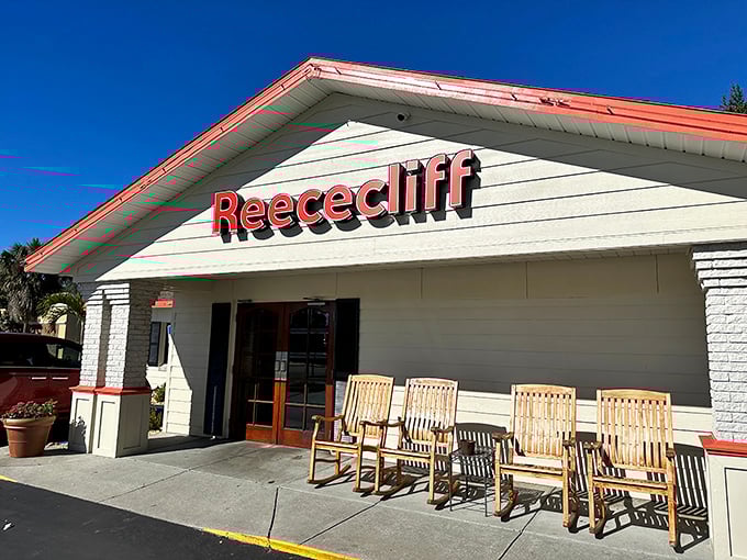 The welcoming facade of Reececliff Family Diner beckons with its classic red trim and row of rocking chairs &ndash; Florida's version of a front porch welcome committee.