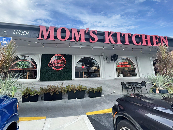The iconic red signage of Mom's Kitchen beckons like a lighthouse for hungry souls, promising all-day breakfast and that unmistakable diner charm that chain restaurants can only dream of replicating.
