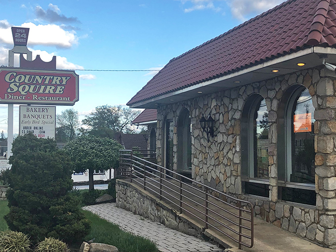 The iconic stone facade and burgundy roof of Country Squire Diner stands as a beacon of breakfast hope along Broomall's bustling roadway.