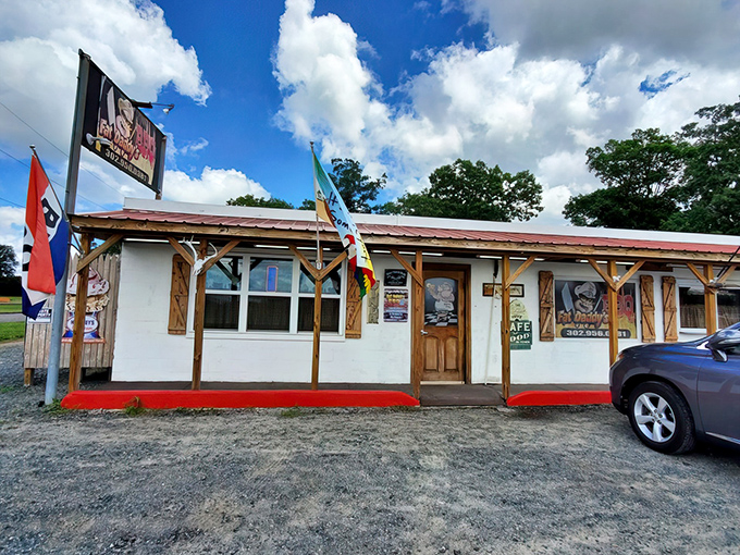 The unassuming exterior of Fat Daddy's BBQ stands like a barbecue beacon in Georgetown, where smoke signals and red trim promise delicious things await inside.