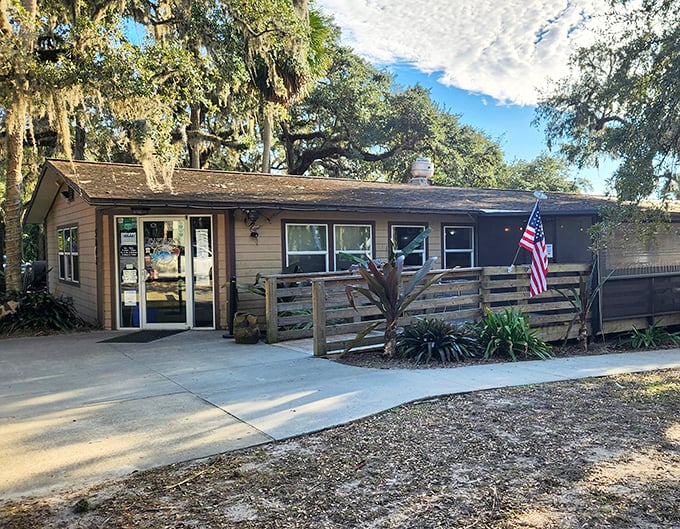 Nestled under Spanish moss-draped oaks, this unassuming building houses barbecue magic that would make Texas nervous.