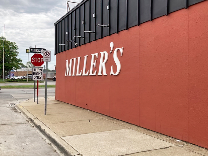 The unmistakable red exterior of Miller's Bar stands as a beacon to burger pilgrims, promising simplicity and perfection behind those unassuming walls.