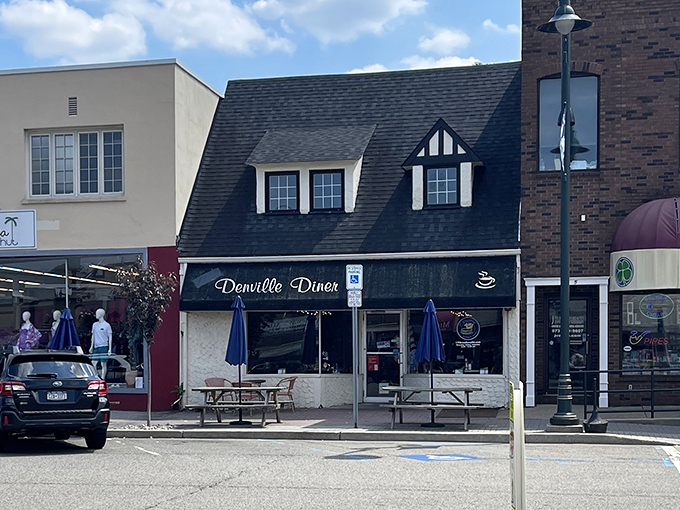 The charming Tudor-style exterior of Denville Diner stands proudly on Broadway, a beacon for breakfast enthusiasts across Morris County.
