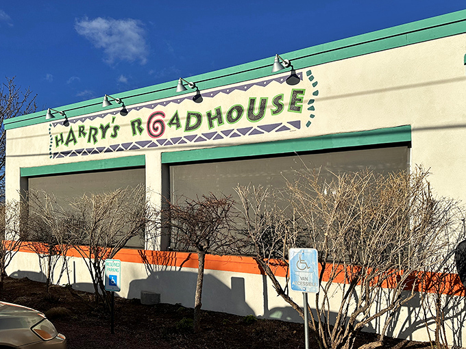 The turquoise-trimmed facade of Harry's Roadhouse beckons like a desert oasis, promising culinary treasures beyond those humble cream-colored walls.